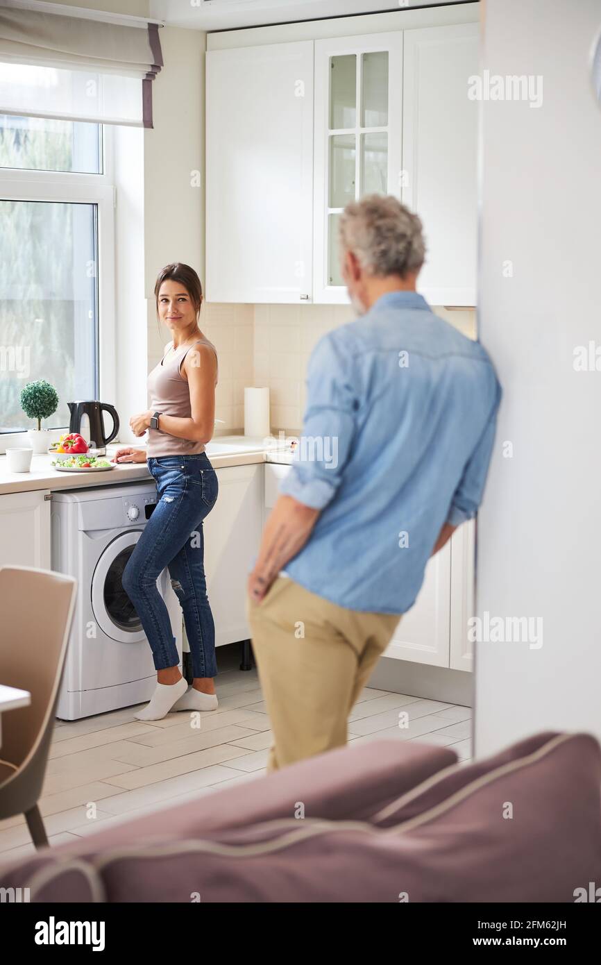 Kind male person leaning on the wall Stock Photo - Alamy