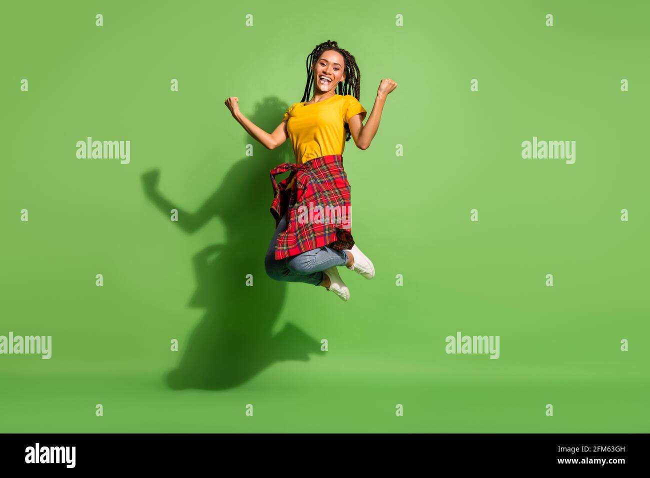 Full length photo of impressed lucky dark skin lady dressed yellow t ...