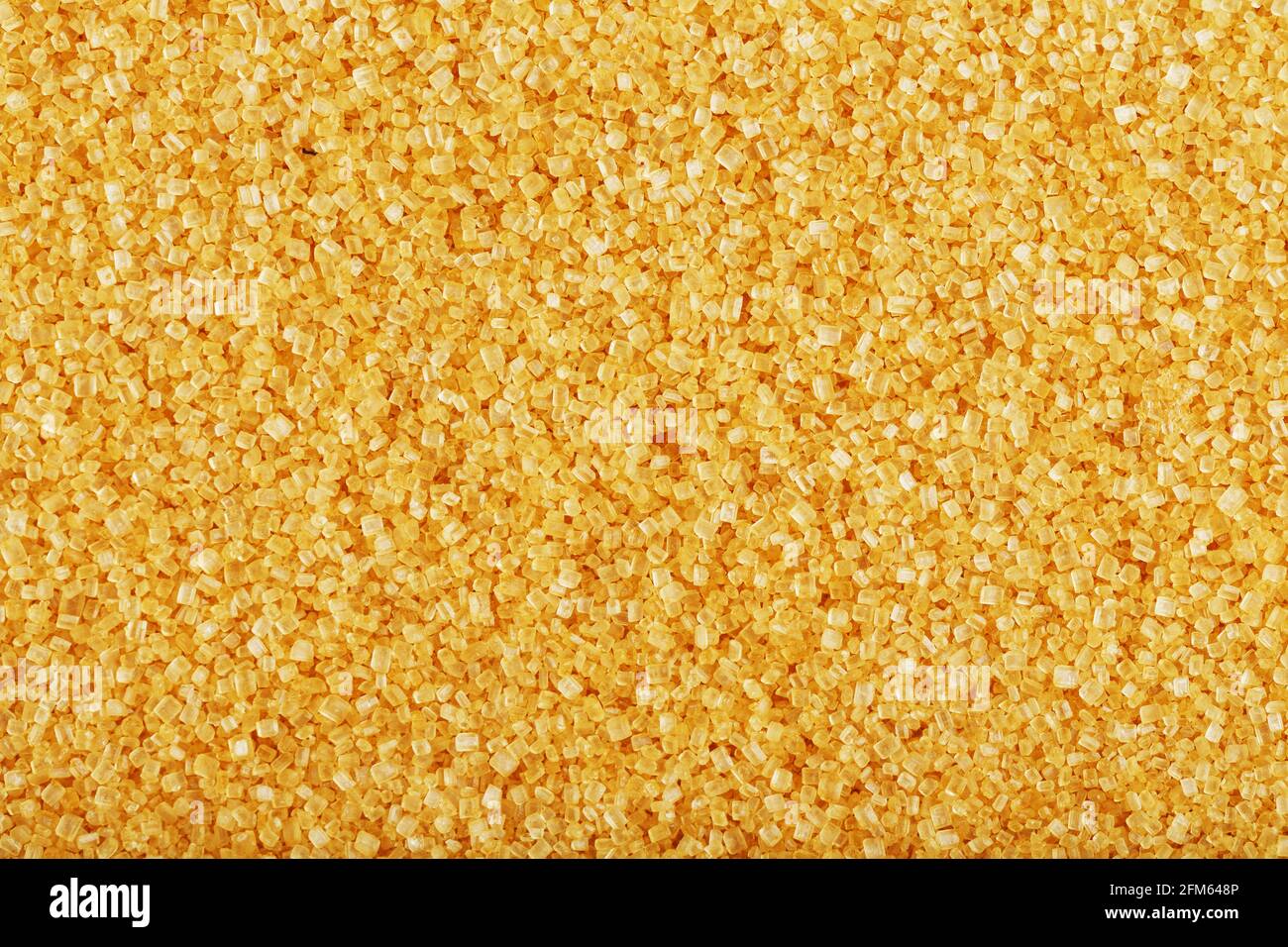 Texture of golden sand on the beach with a solid background in full ...