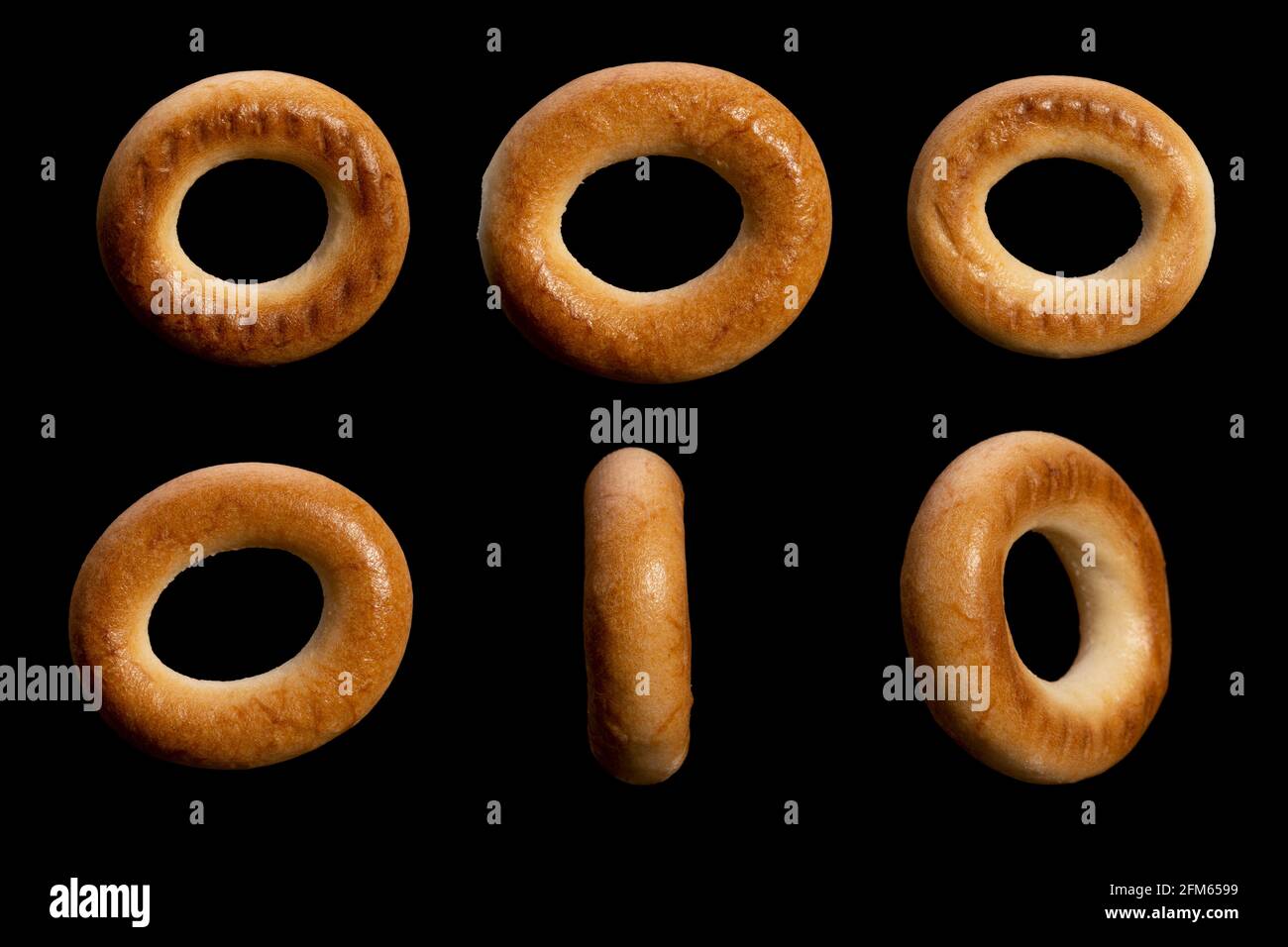 set of round bagels isolated on black background. High quality photo ...