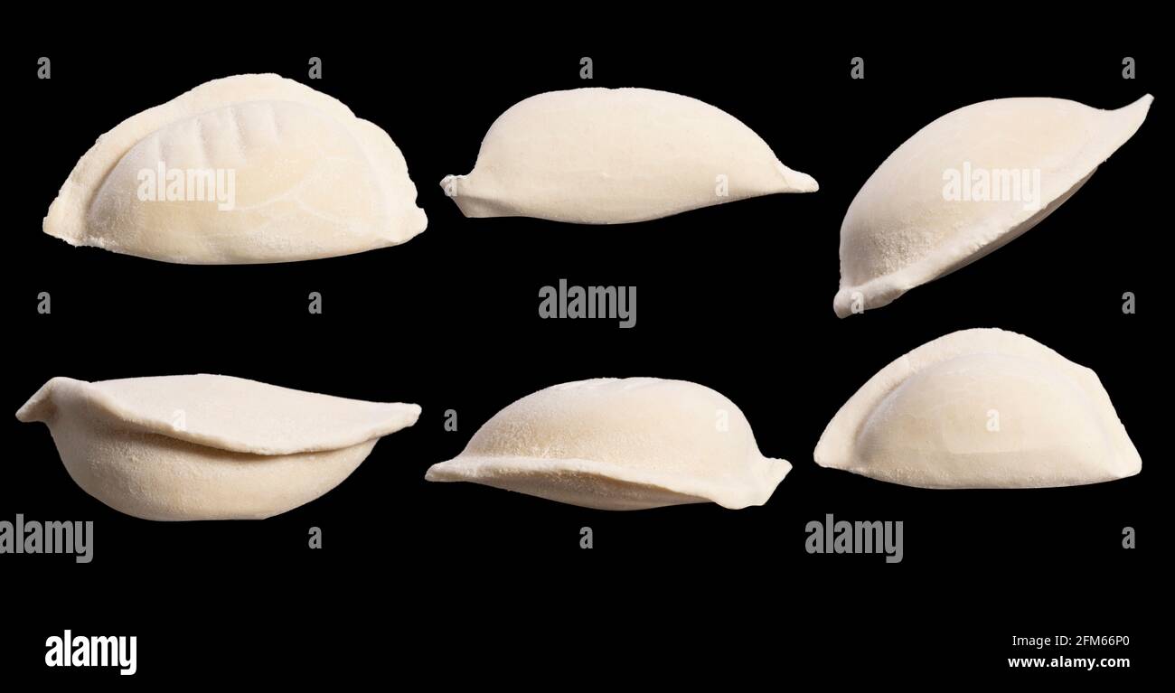 set of raw dumplings isolated on black background. High quality photo ...