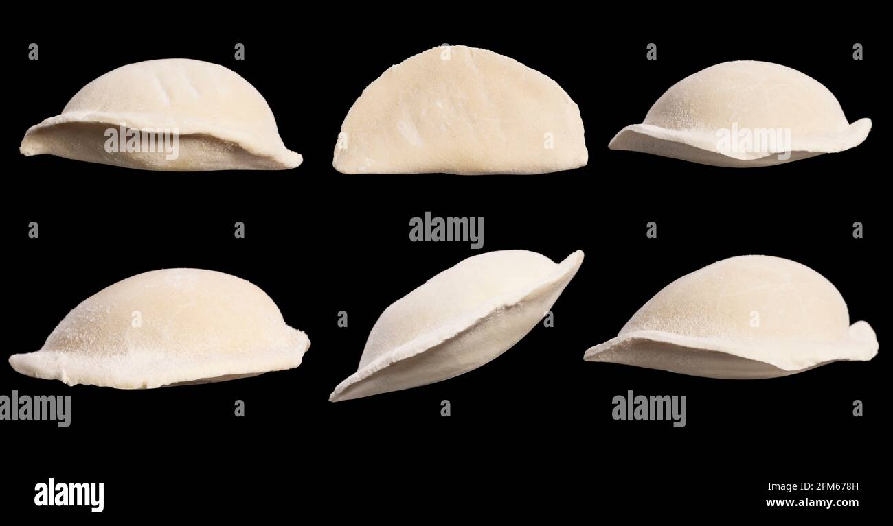 set of raw dumplings isolated on black background. High quality photo ...