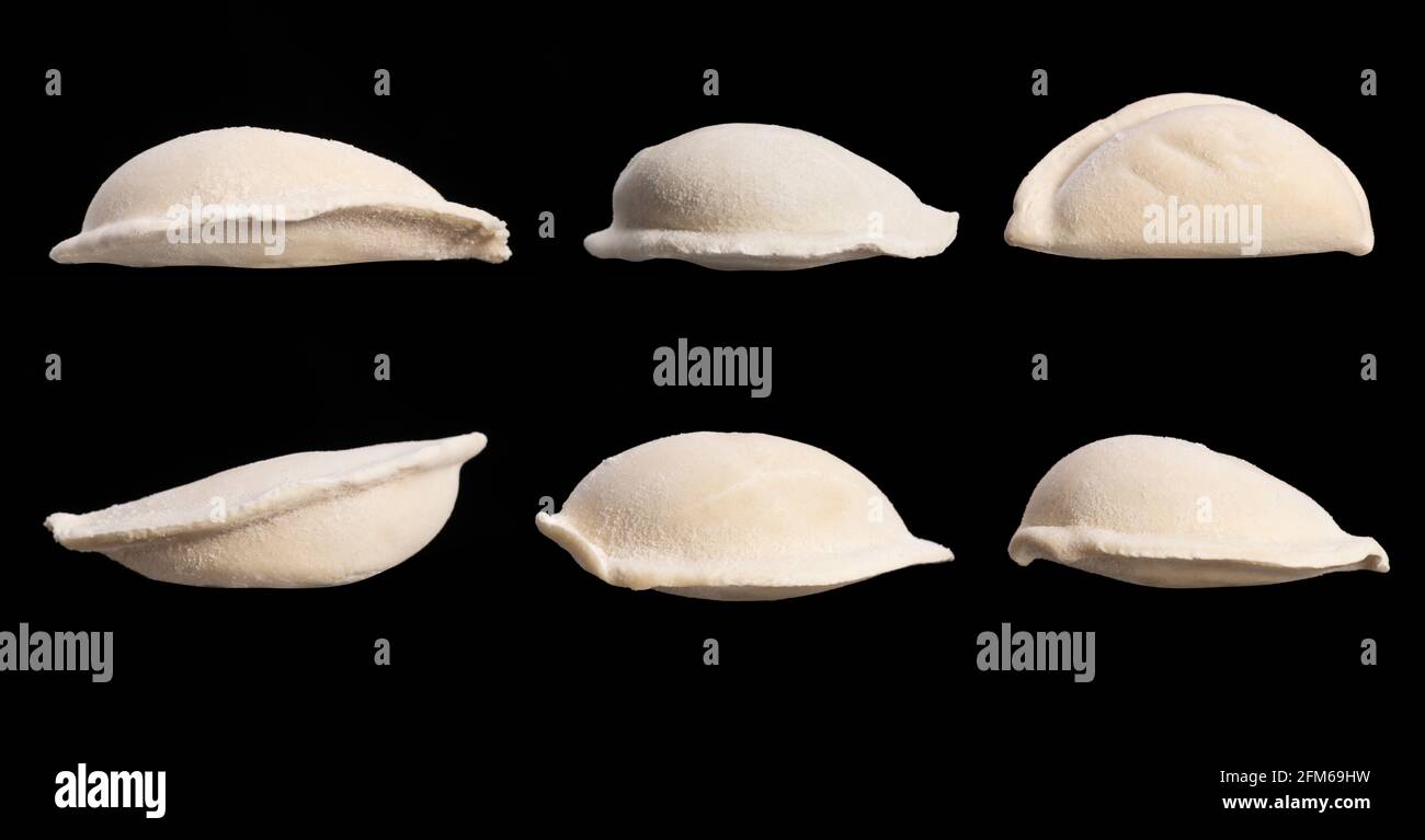 set of raw dumplings isolated on black background. High quality photo ...