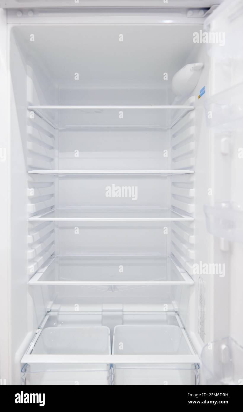 An empty refrigerator. Inside an empty, clean refrigerator, a ...