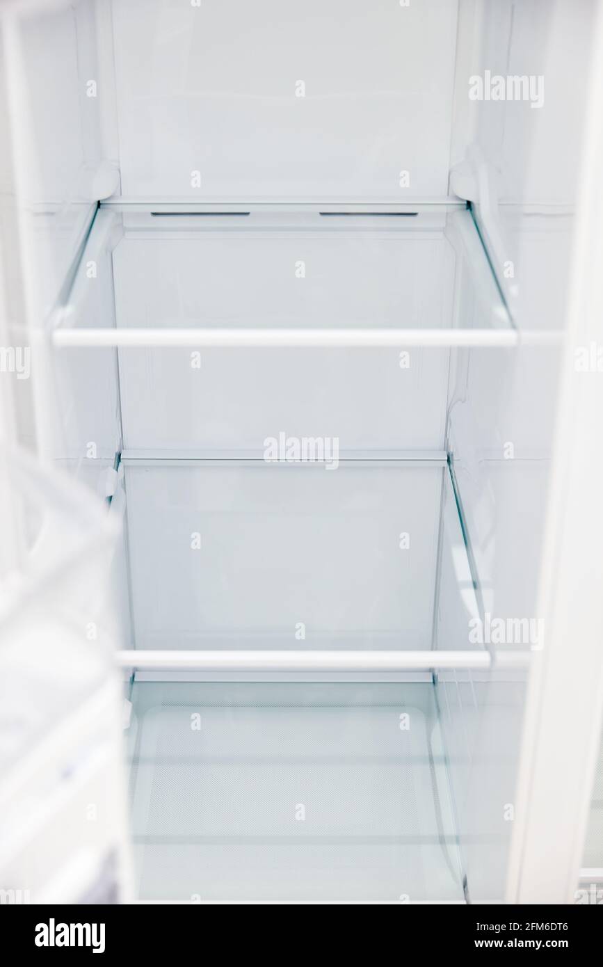 An empty refrigerator. Inside an empty, clean refrigerator, a ...
