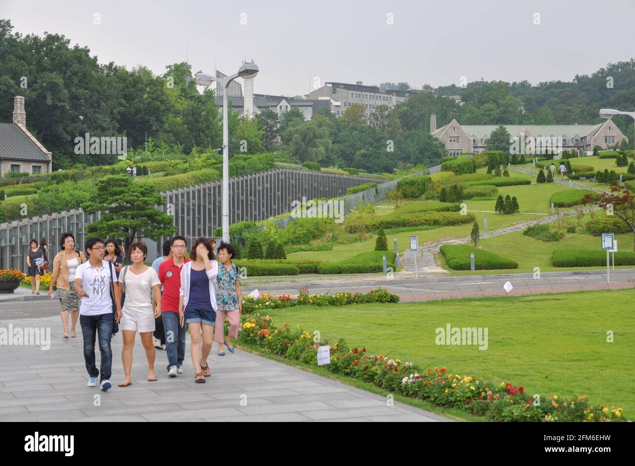 People walking on Ewha Campus Complex on a humid midsummer day in Seoul ...
