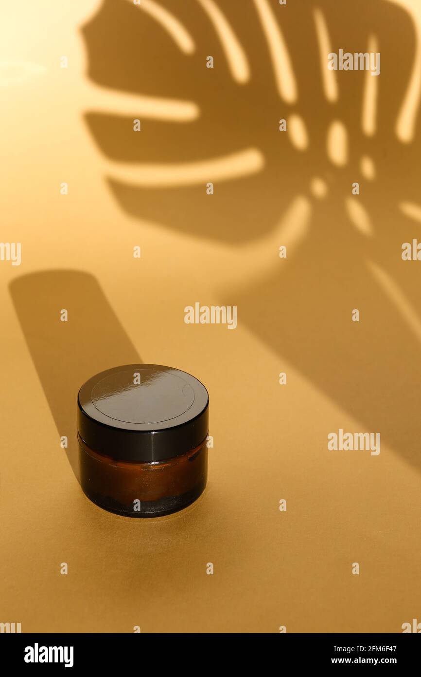 Glass jar with body cream Stock Photo - Alamy