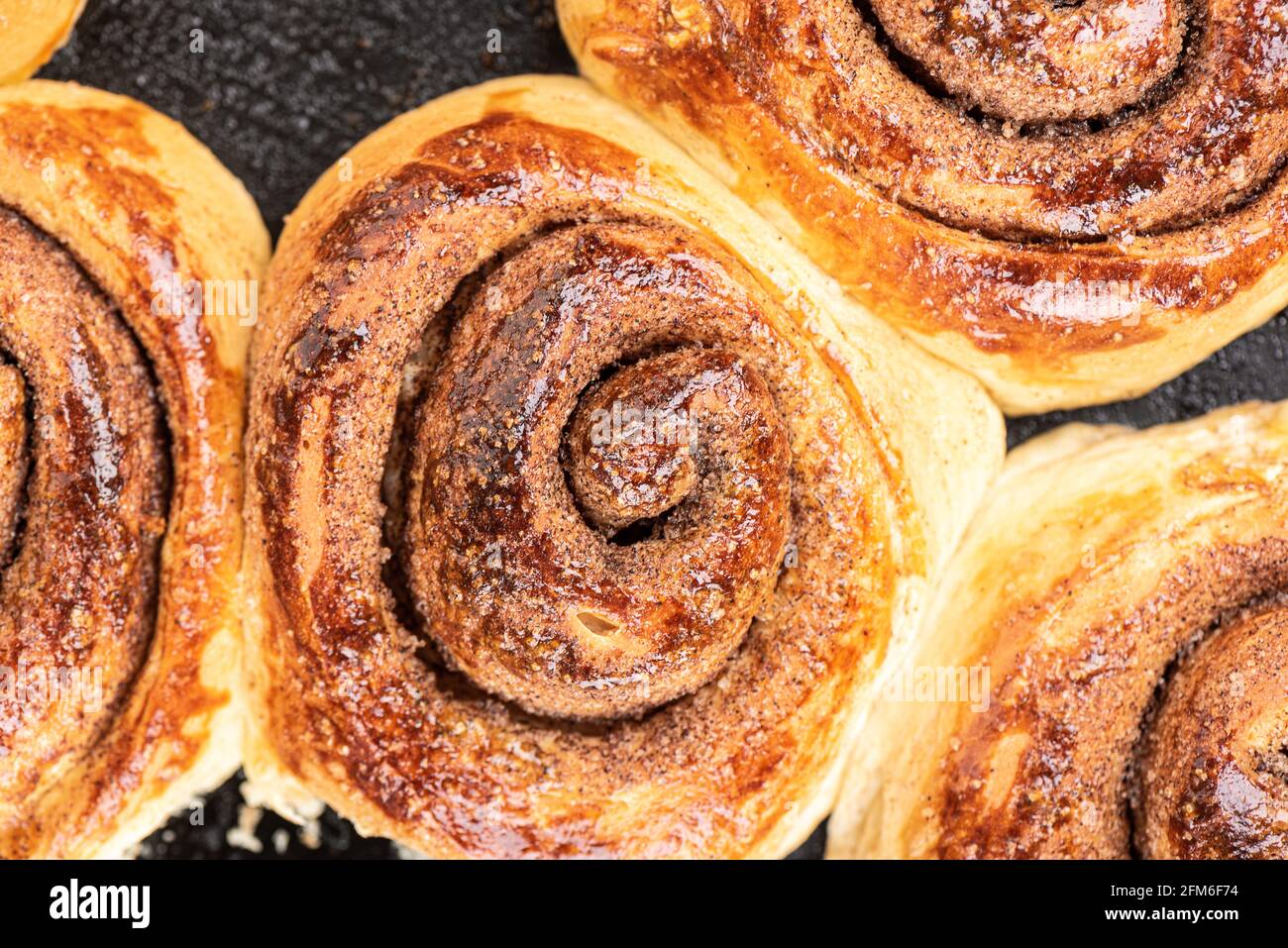 Close-up of a freshly baked cinnabon bun. Top view. Homemade buns Stock ...