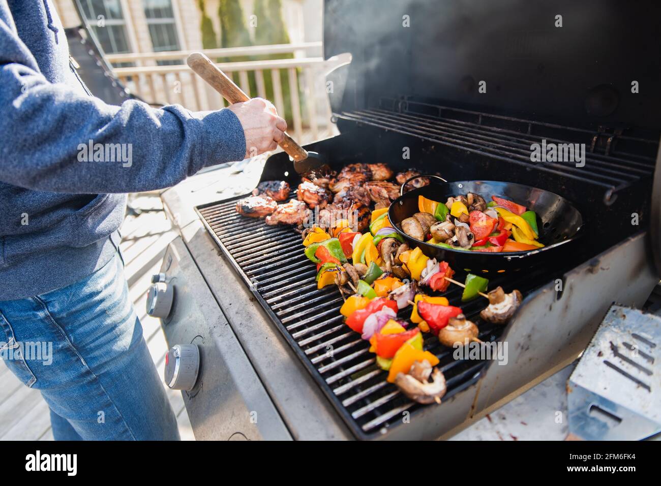 Man grilling chicken on hi-res stock photography and images - Alamy