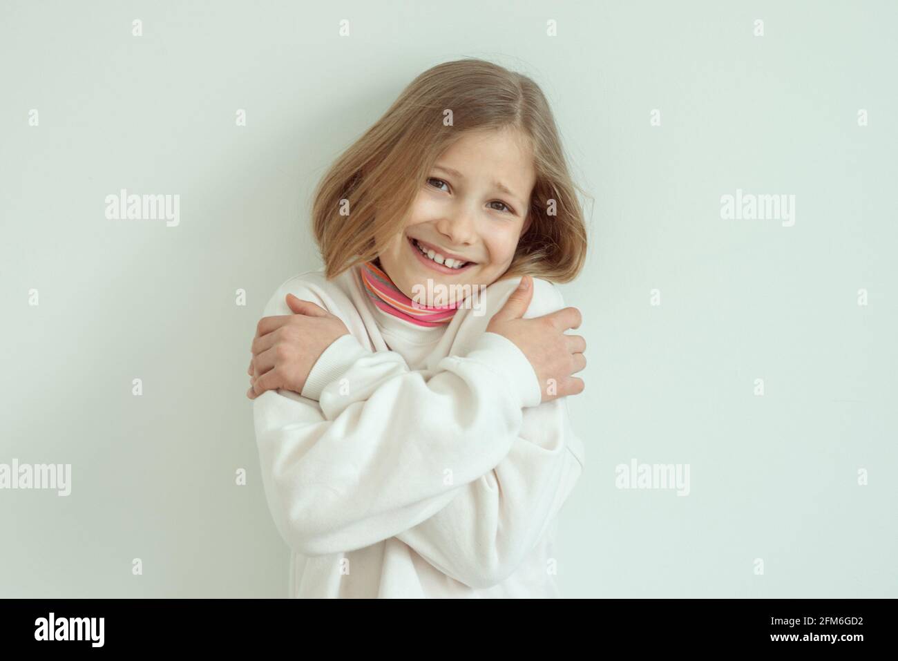 Scared pretty teen girl crossed her hand with panic face on white ...