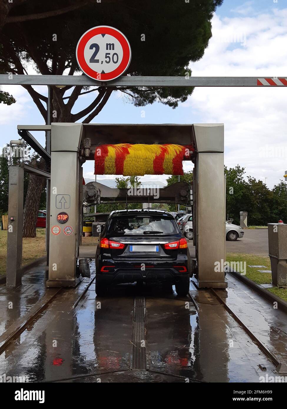 Car inside the automatic car wash in operation Stock Photo - Alamy