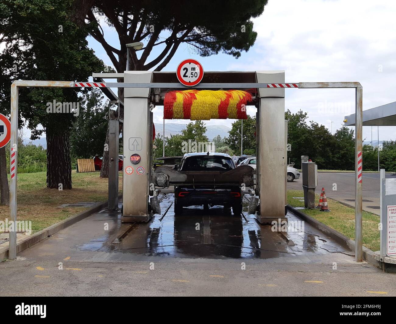 Car inside the automatic car wash in operation Stock Photo - Alamy
