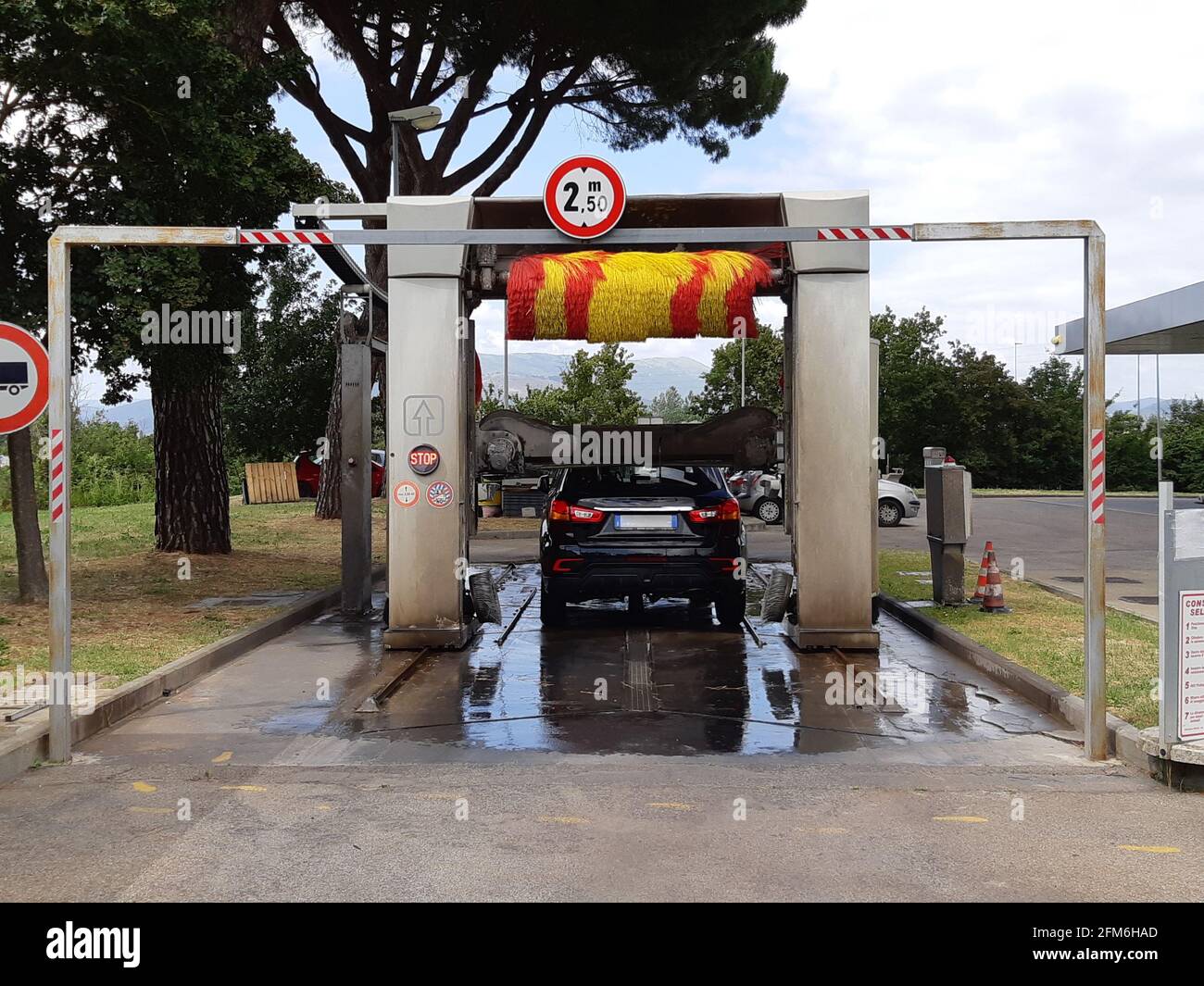 Car inside the automatic car wash in operation Stock Photo - Alamy