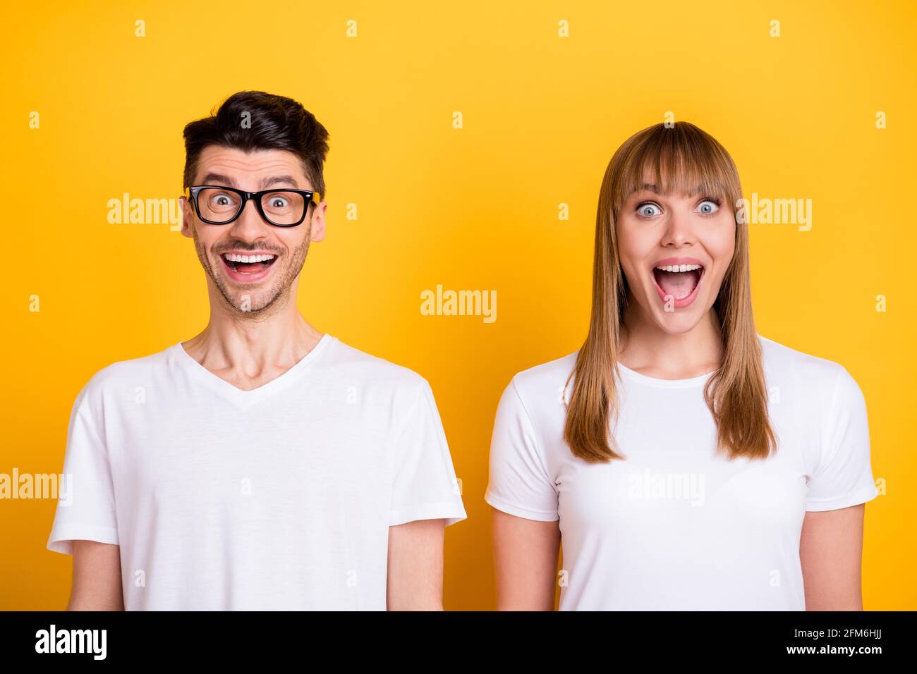 Photo of shocked funny two people dressed white t-shirt glasses open ... Photo of shocked funny two people dressed white t-shirt glasses open ...