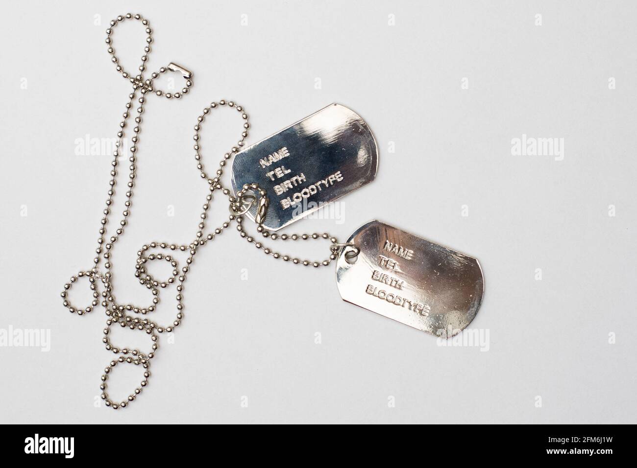 Shiny Blank Metallic Military Identification Plate on White Background Stock Photo - Alamy