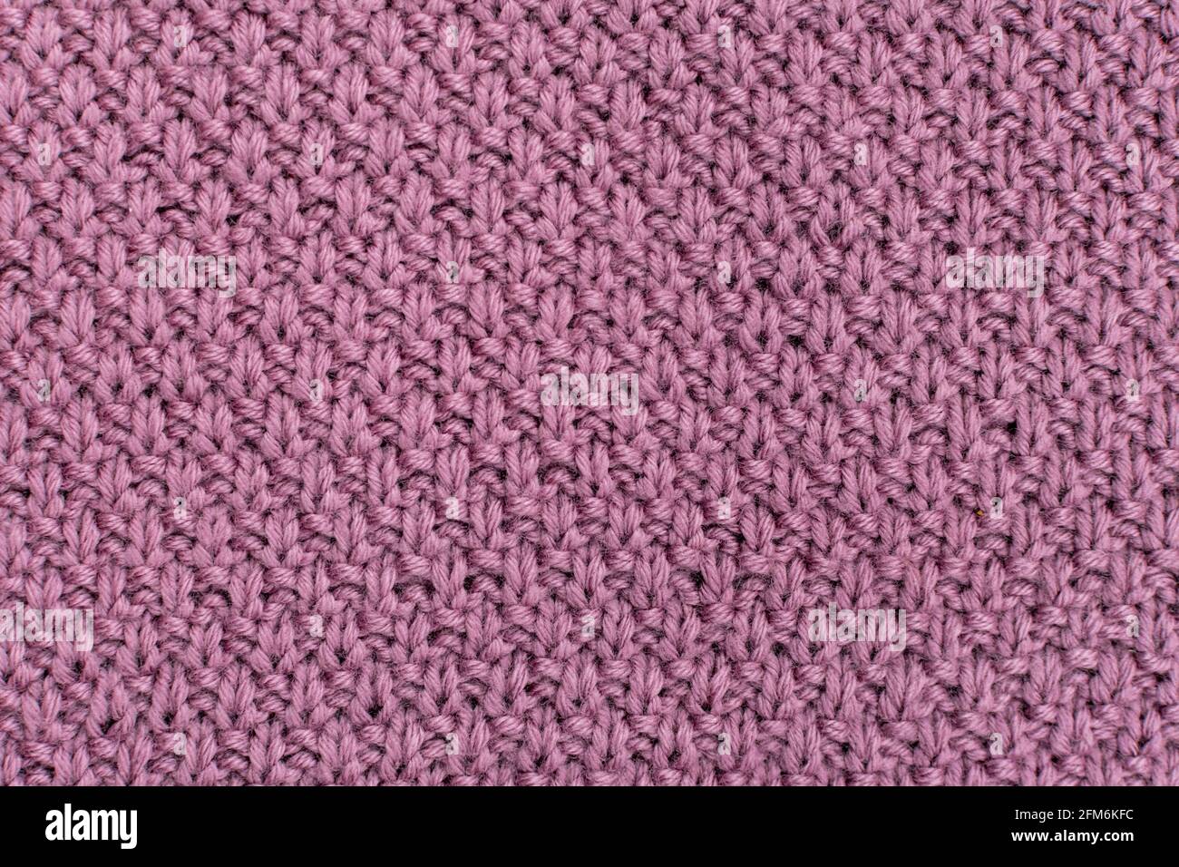 Knitted fabric pearl woolen background. The structure of the fabric ...