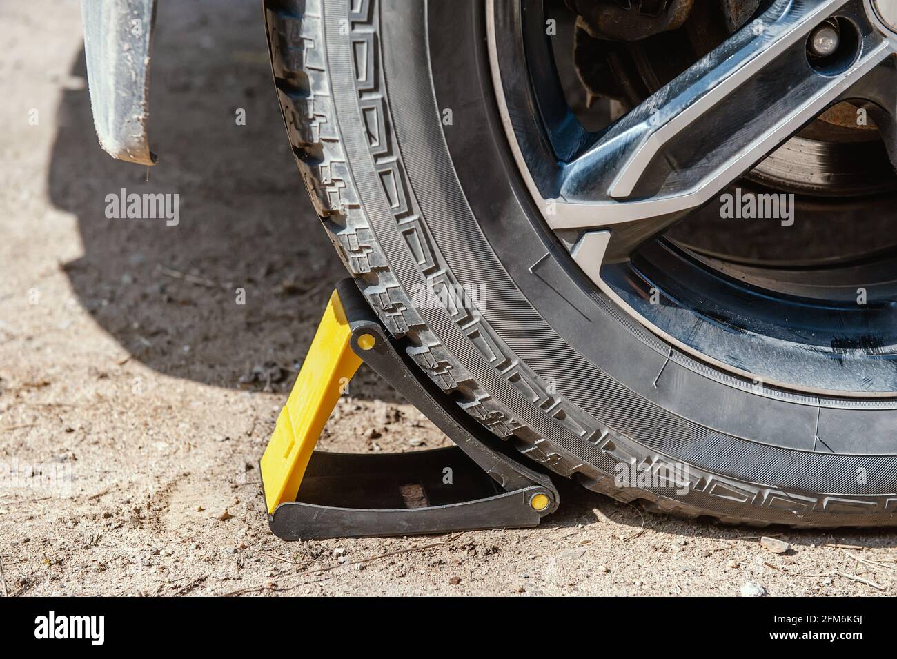 wheel chocks for restricting movement under the wheel of the car ...