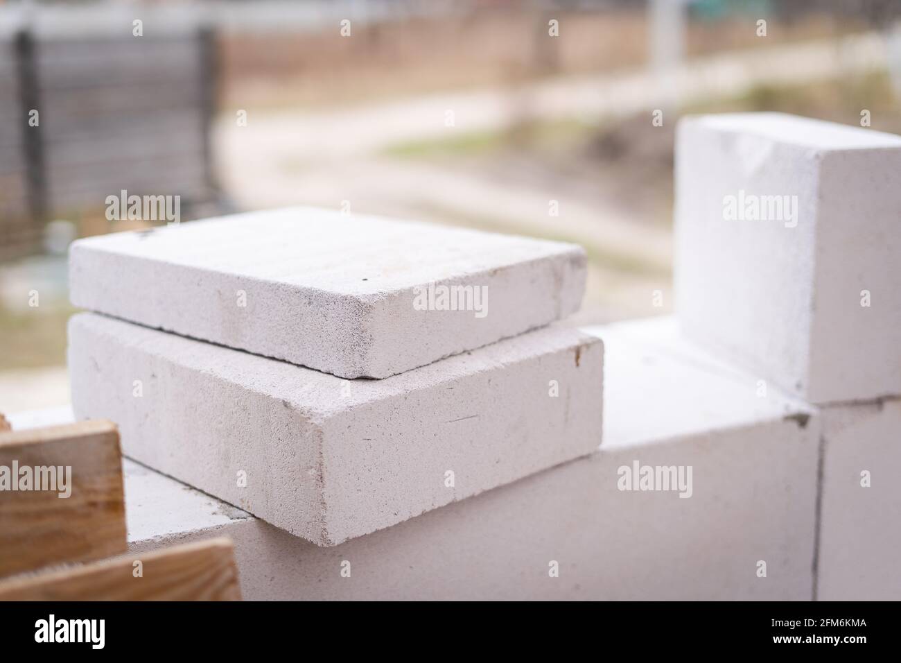 Cut-to-size aerated concrete blocks lie at the construction site Stock ...