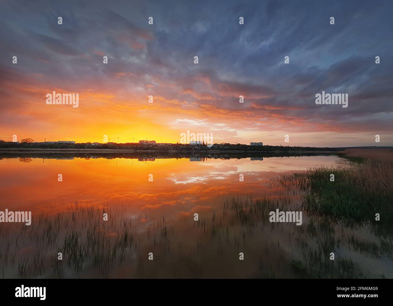 Fascinating sunset reflecting on the lake surface. Idyllic landscape ...