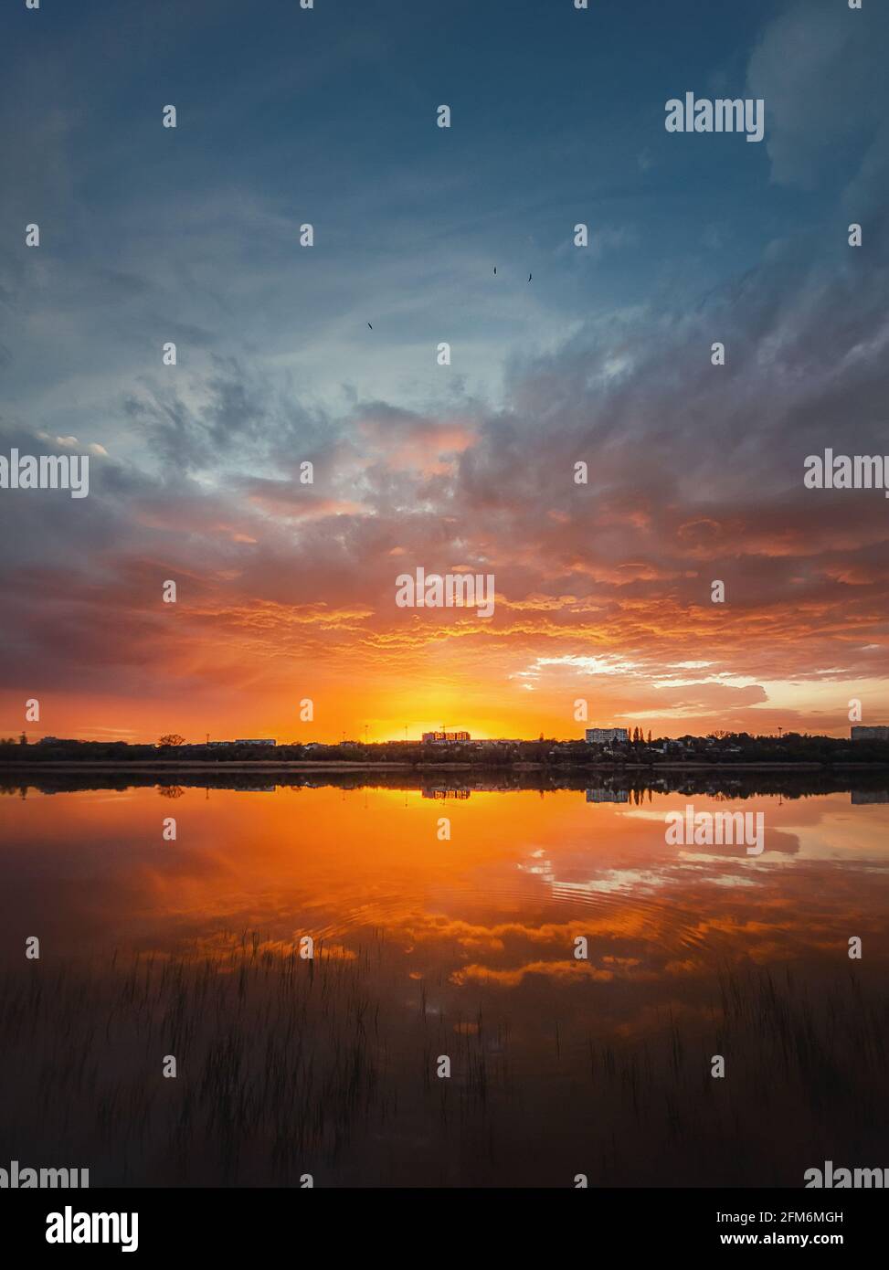 Fascinating sunset reflecting on the lake surface. Idyllic landscape ...