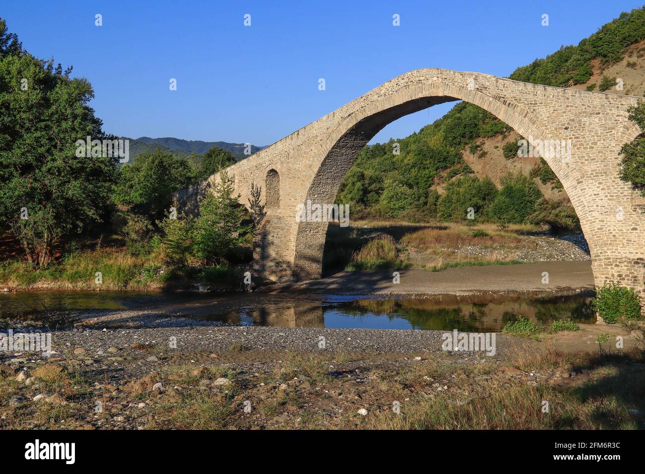 Old stone bridge of Aziz Aga, Venetikos river, Grevena, Macedonia ...