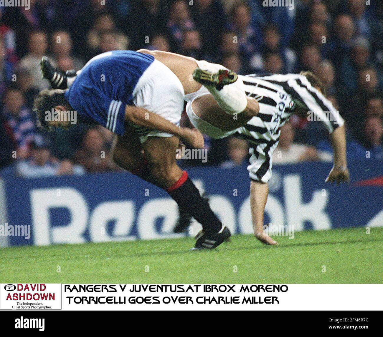 Rangers Charlie Miller and Juventus Moreno Torricelli clash during the ...