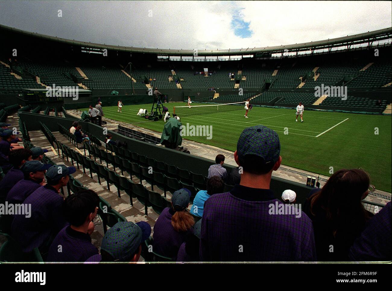 Four members of the All England Tennis Club test out the new number one ...