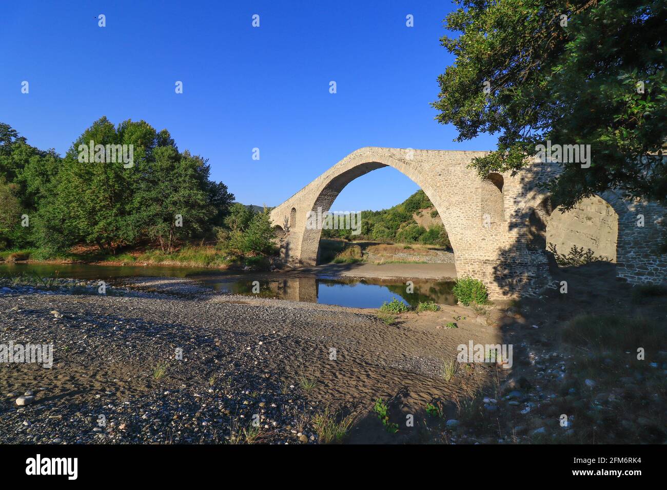 Old stone bridge of Aziz Aga, Venetikos river, Grevena, Macedonia ...