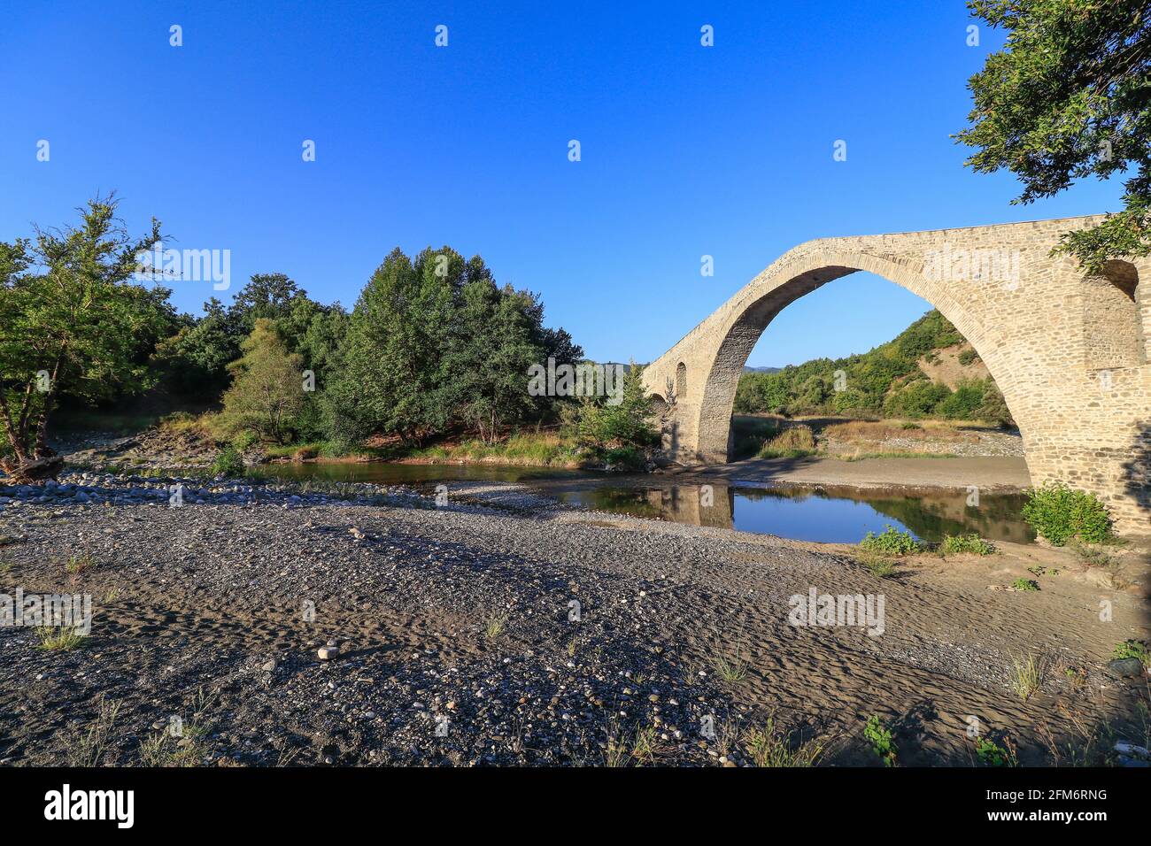 Old stone bridge of Aziz Aga, Venetikos river, Grevena, Macedonia ...