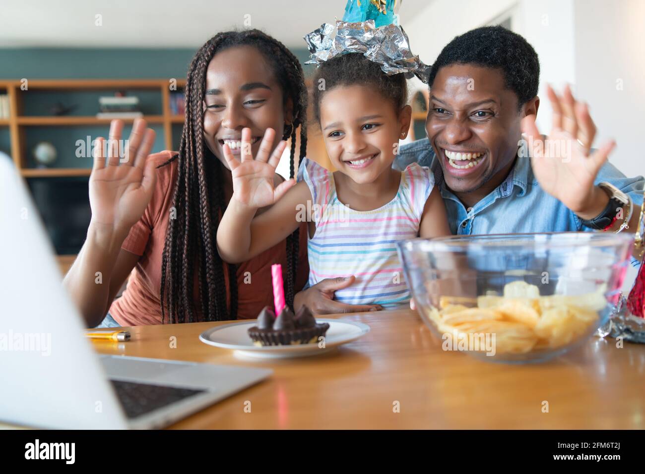 Family celebrating birthday on a video call Stock Photo - Alamy