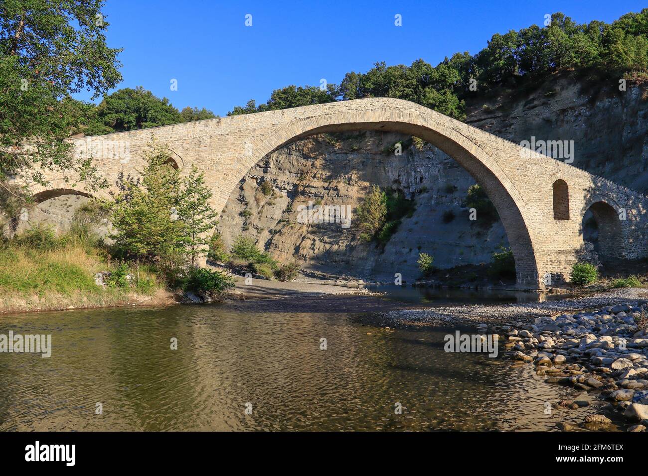 Old stone bridge of Aziz Aga, Venetikos river, Grevena, Macedonia ...