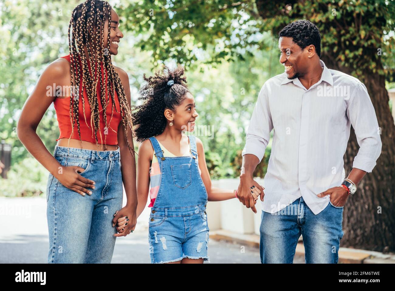 Family enjoying a walk together outdoors Stock Photo - Alamy