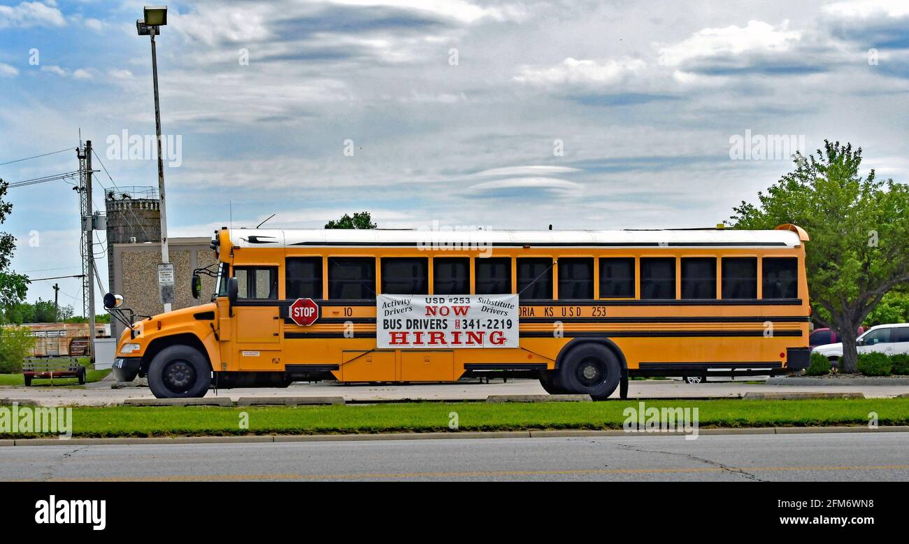 School bus drivers needed hiring signs are posted on side of school bus ...