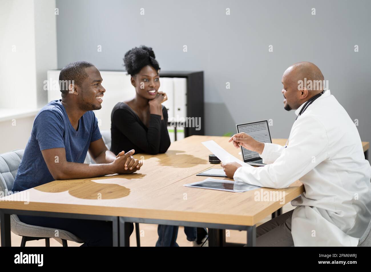 Happy African Pregnant Couple Patient At Doctor Stock Photo - Alamy