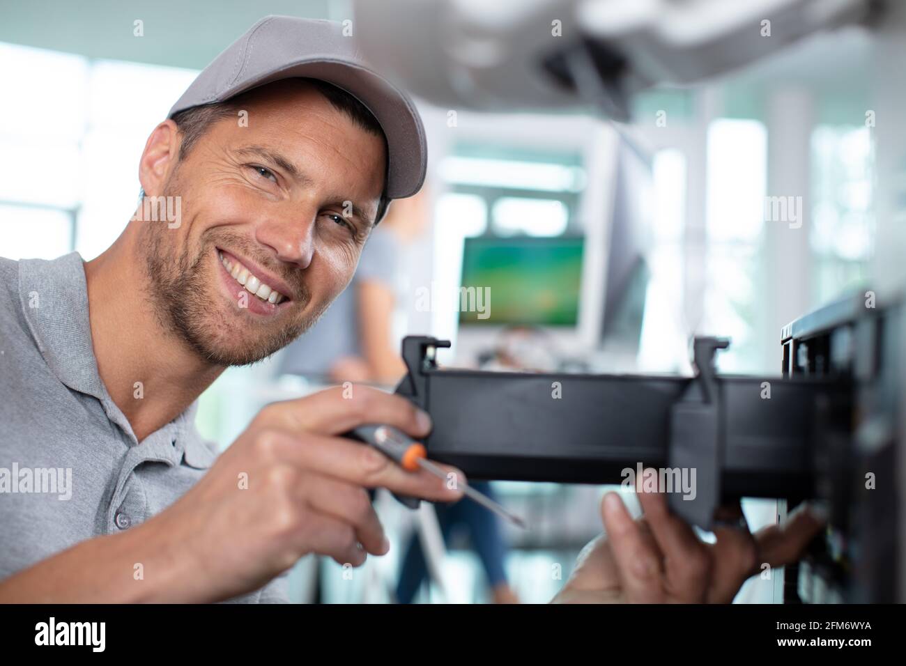 happy man fixing a printer Stock Photo - Alamy