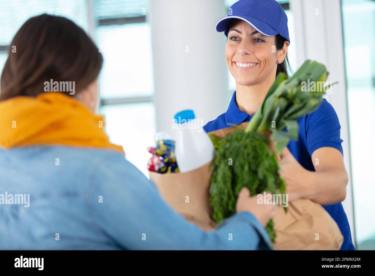 young woman delivering food during pandemic Stock Photo - Alamy
