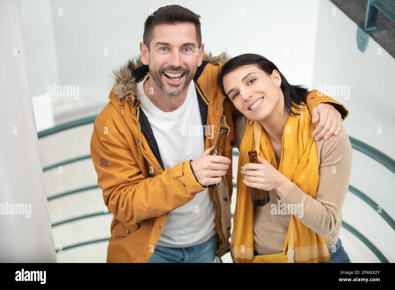image of happy young couple back from the party drunk Stock Photo - Alamy