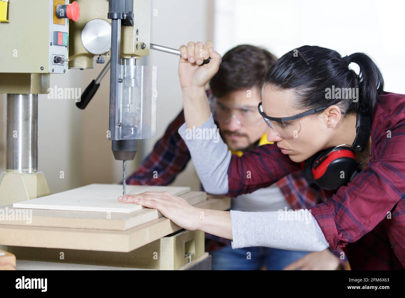 Worker using bench drill hi-res stock photography and images - Alamy