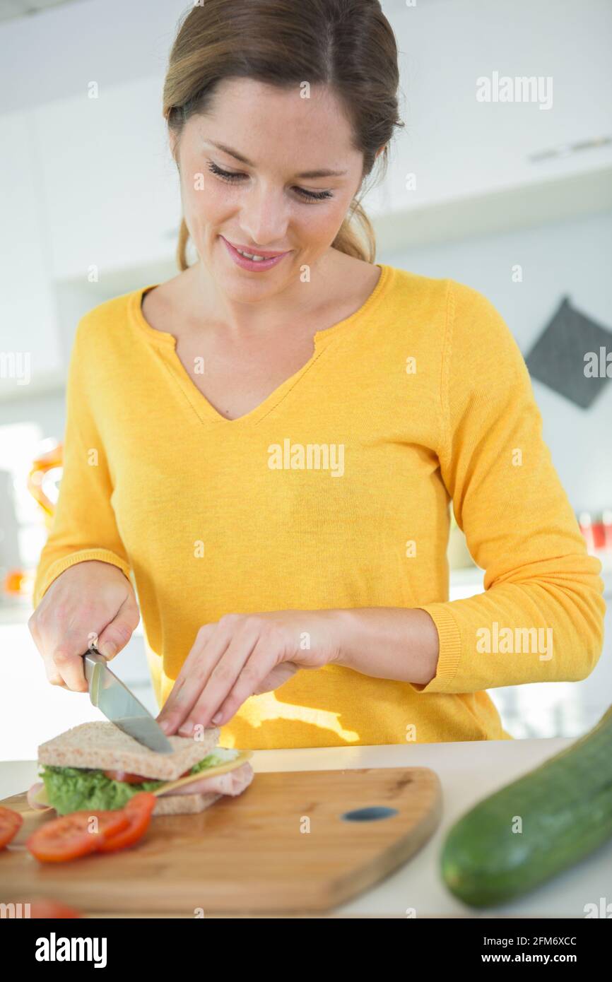 woman making herself a sandwich Stock Photo - Alamy