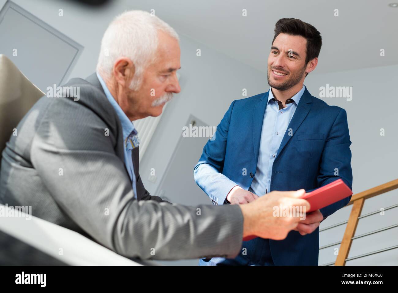 giving the proposal to the boss Stock Photo - Alamy