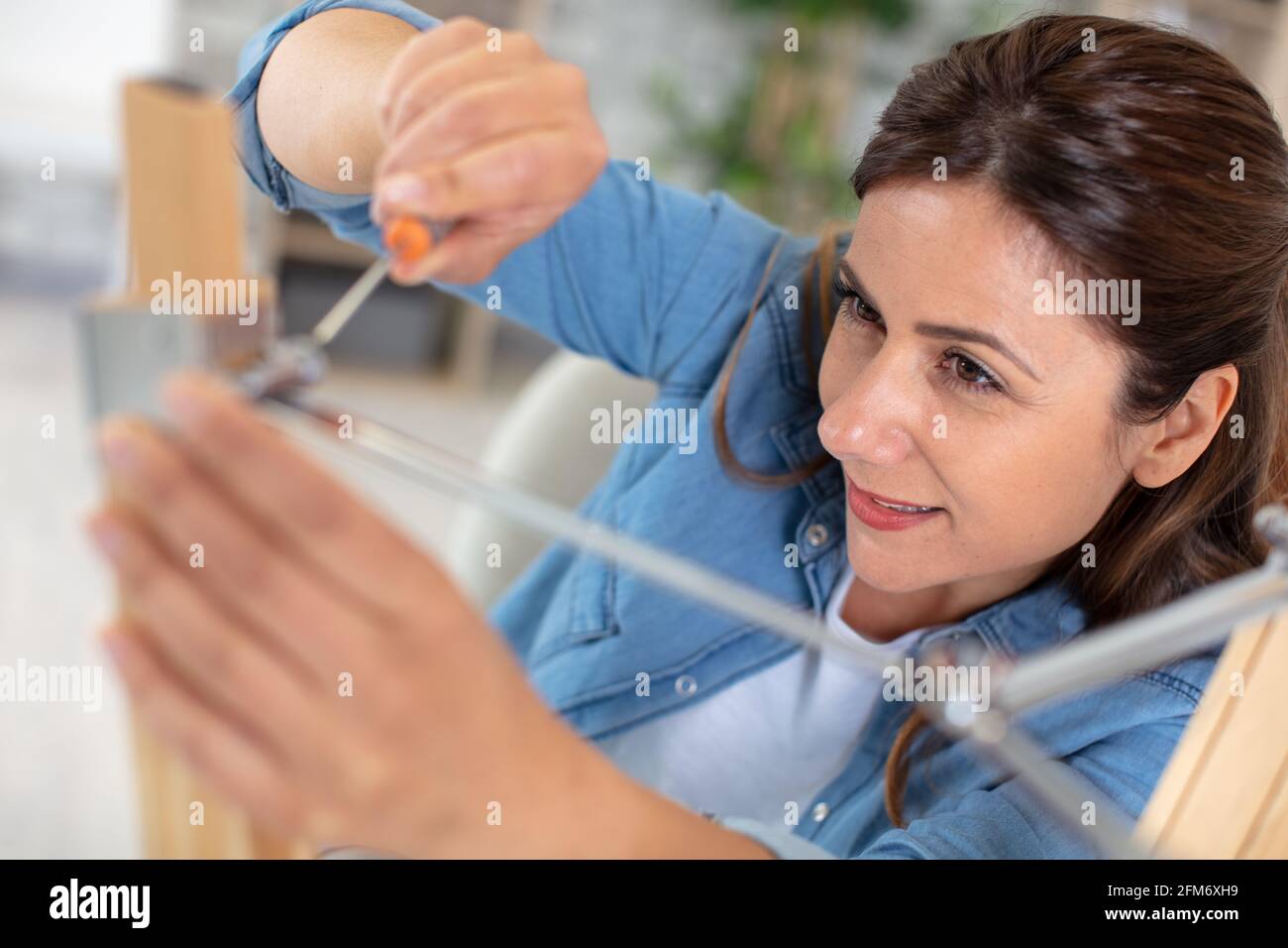 Woman with tool belt diy hi-res stock photography and images - Alamy