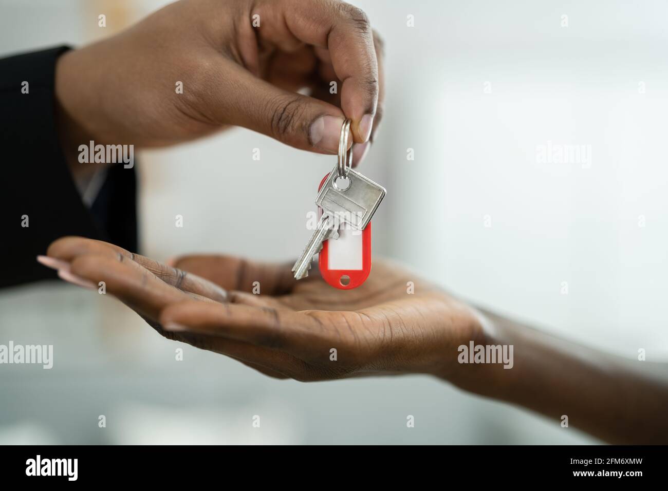 Real Estate House Key Handover By Agent Stock Photo - Alamy