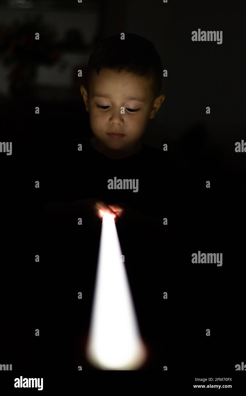 Portrait of child boy playing with a led bar light Stock Photo - Alamy
