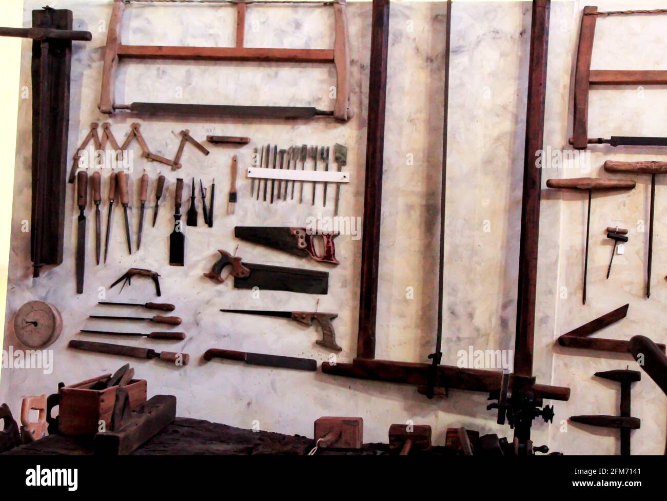 Old metal tools hanging on a wall of a workshop in Spain Stock Photo ...