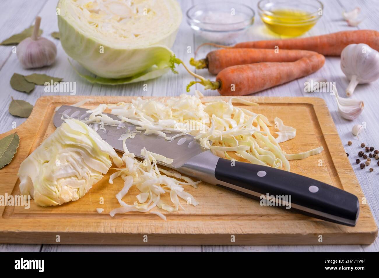 Kitchen workspace with the process of shredding white cabbage Stock ...