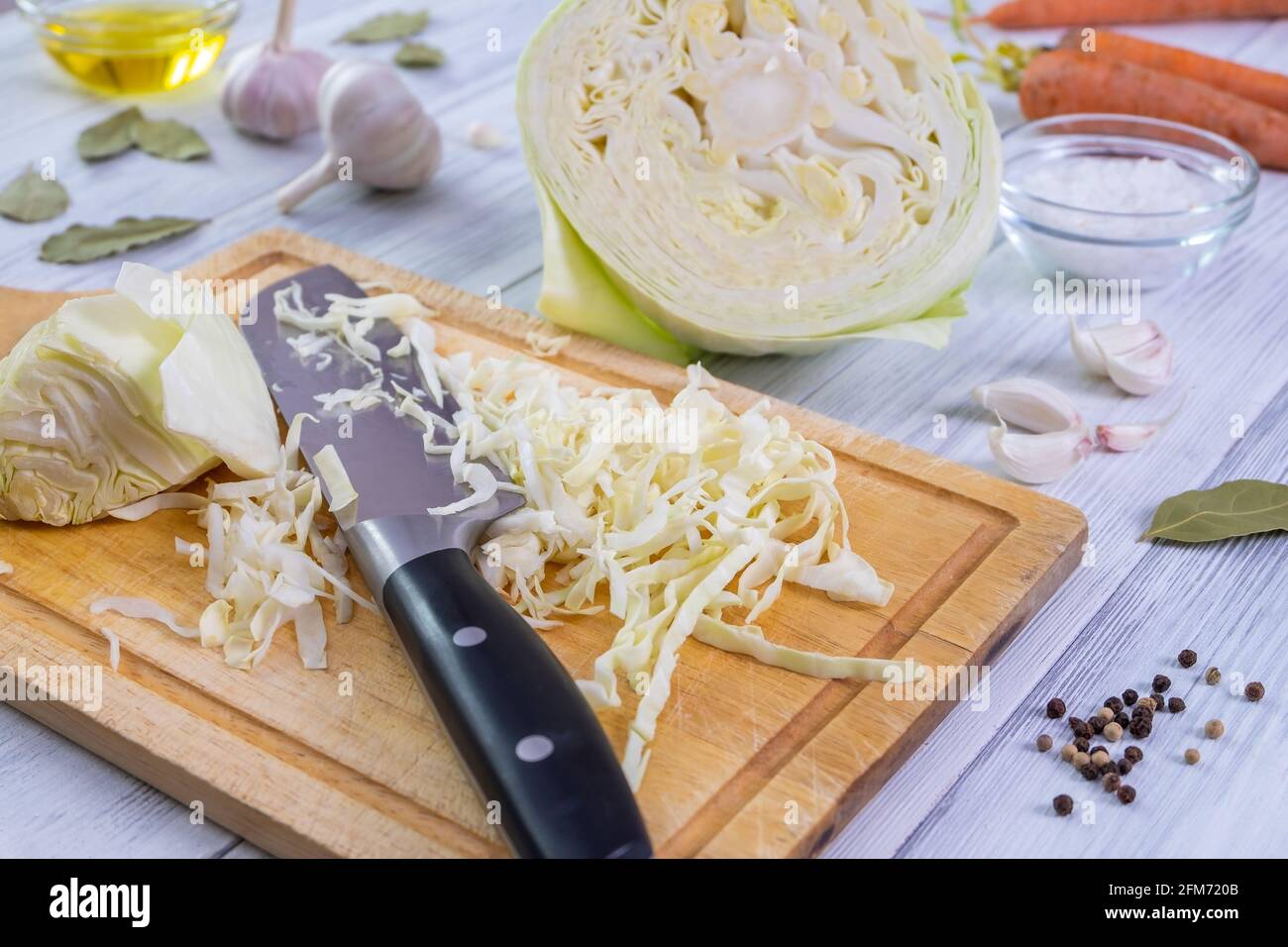 Kitchen workspace with the process of shredding white cabbage Stock ...