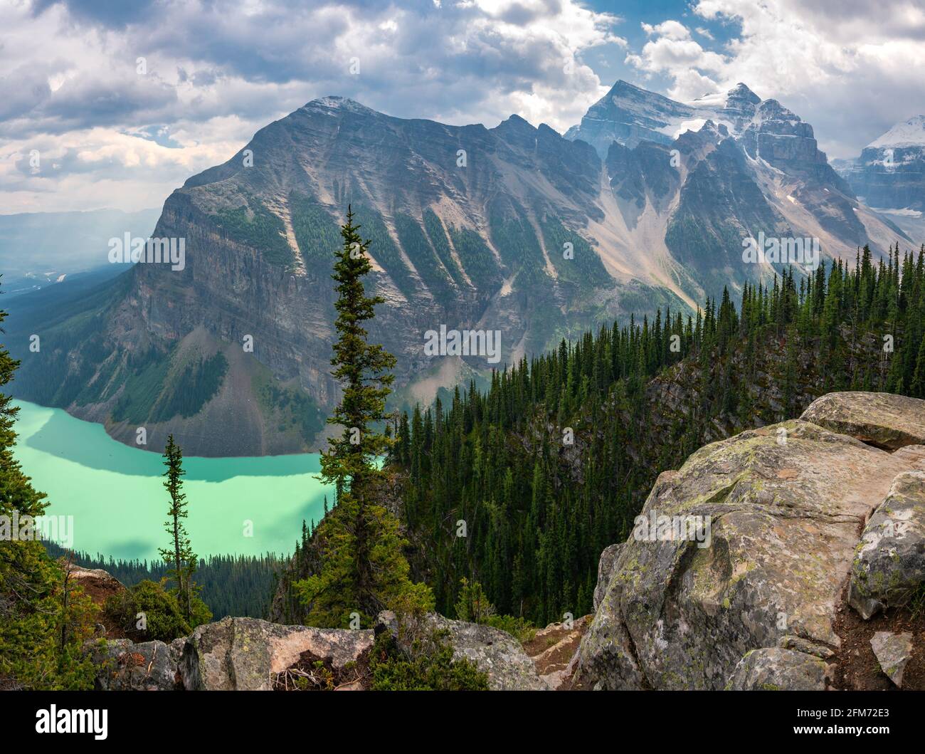 Panorama of turquoise Lake Louise and mountain range in Banff National ...