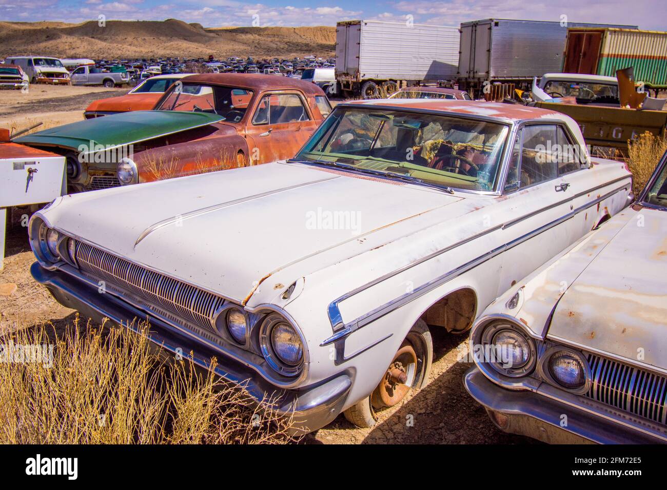Old retro white car in the junkyard Stock Photo - Alamy