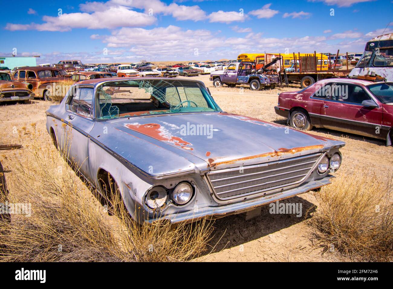 Old retro blue car in the junkyard Stock Photo - Alamy