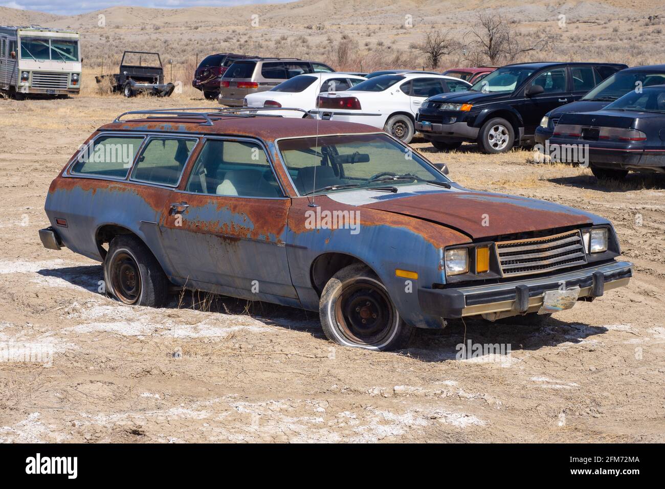 Old retro rusty car in the junkyard Stock Photo - Alamy